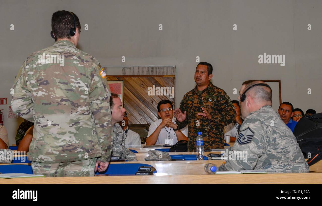 El Salvador Army Capt. Leonel Maye, center standing, artillery commander for La Fuerza Armada de ...