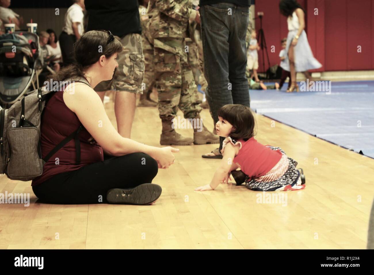 Amy Knodel (Left) and Emily Knodel (right) wait for their loved one ...