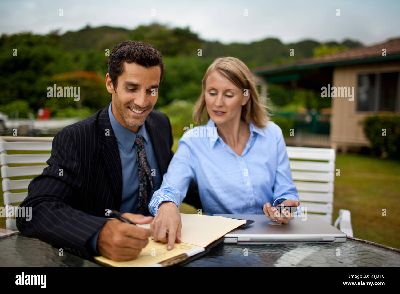 Business man woman talk sit outdoors hi-res stock photography and ...