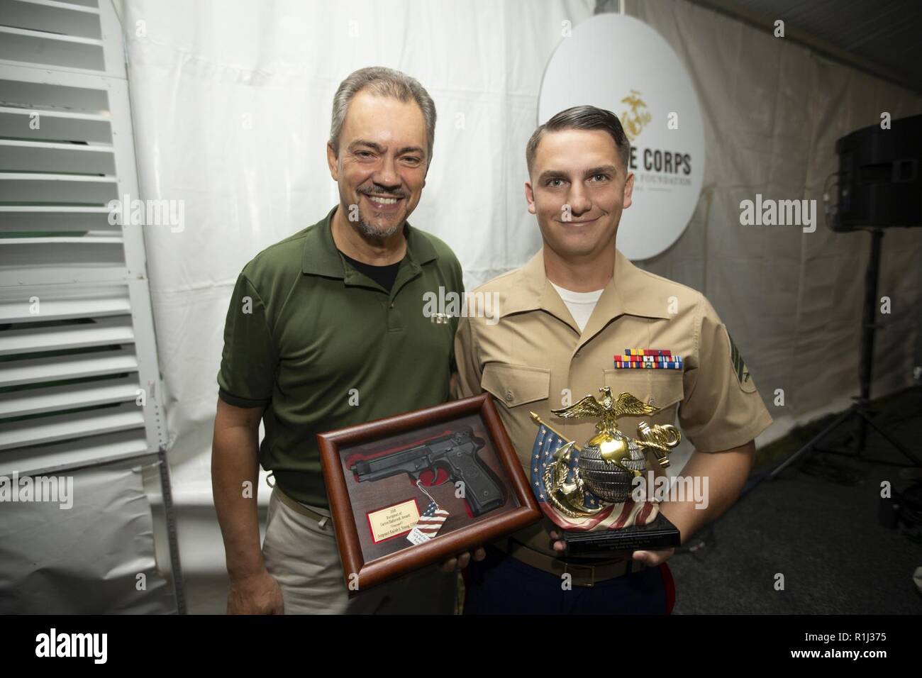Recipients of the Enlisted Awards pose with family and friends for a ...