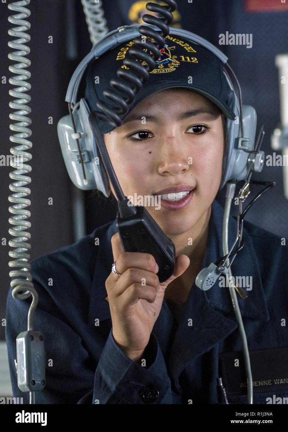 SOUTH CHINA SEA (Sept 26, 2018) Ensign Adrienne Wang stands watch as ...