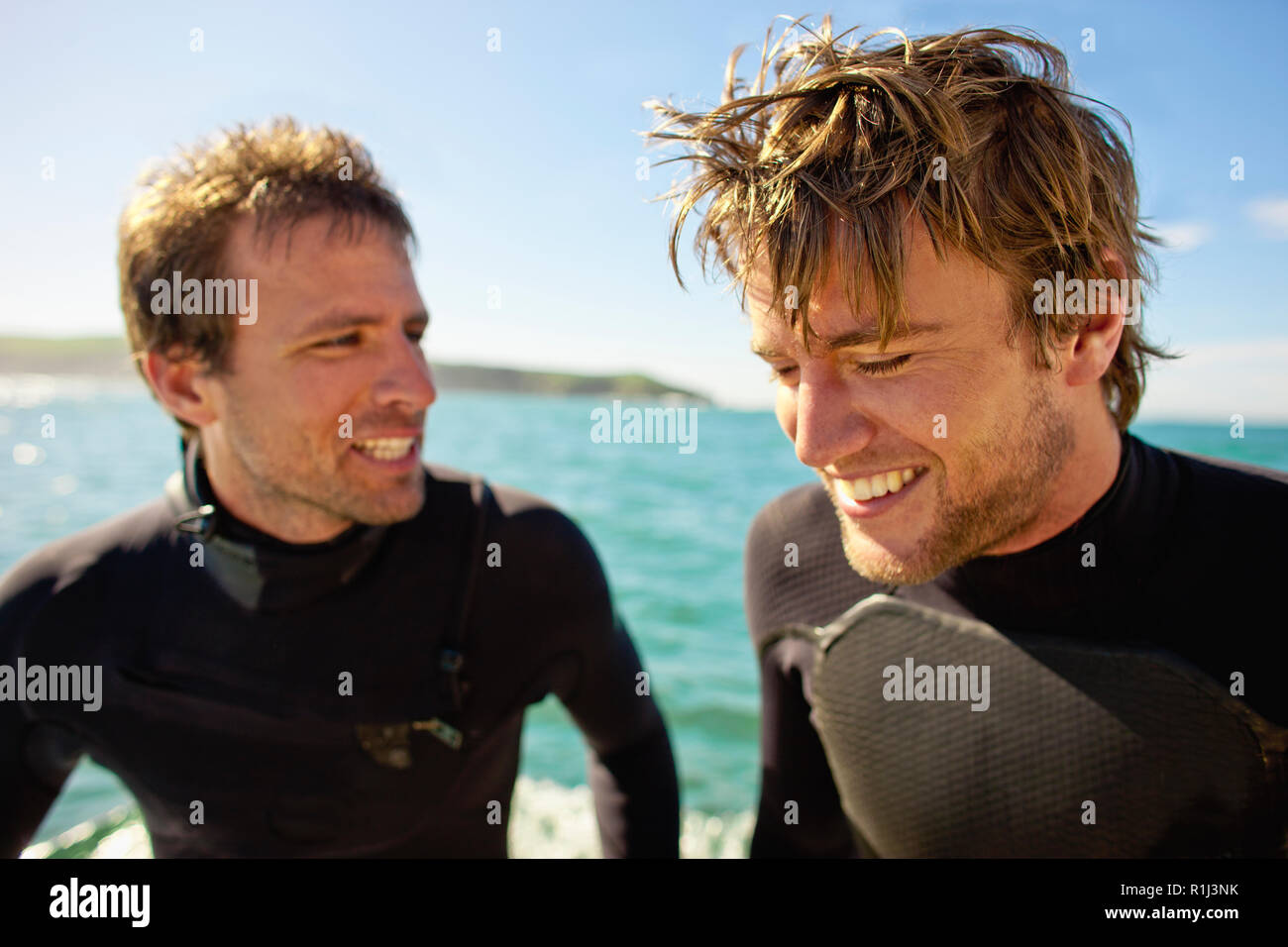 Two men surfers in wetsuits hi-res stock photography and images - Alamy