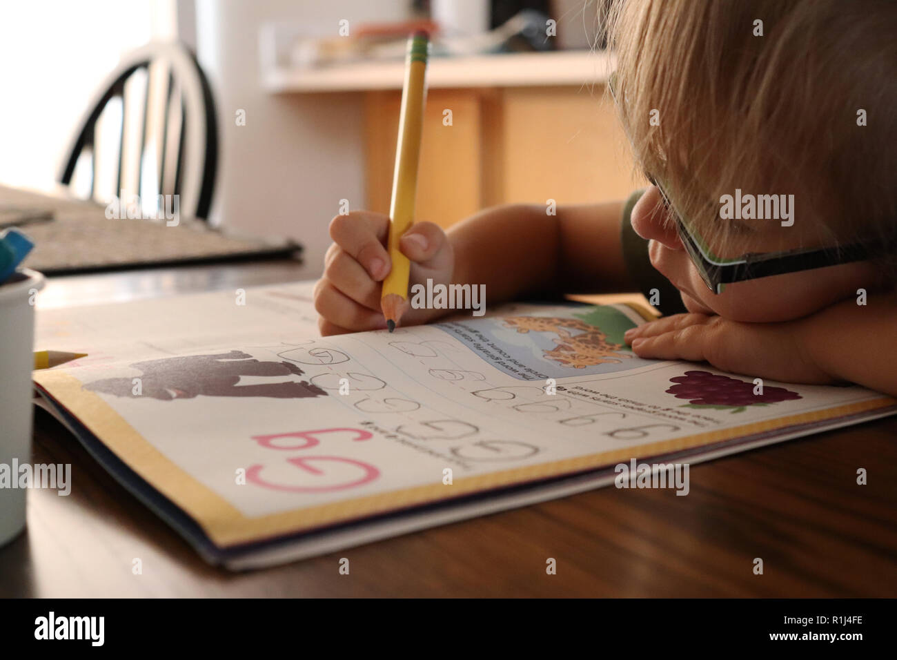 Child portrait write homework hi-res stock photography and images - Alamy