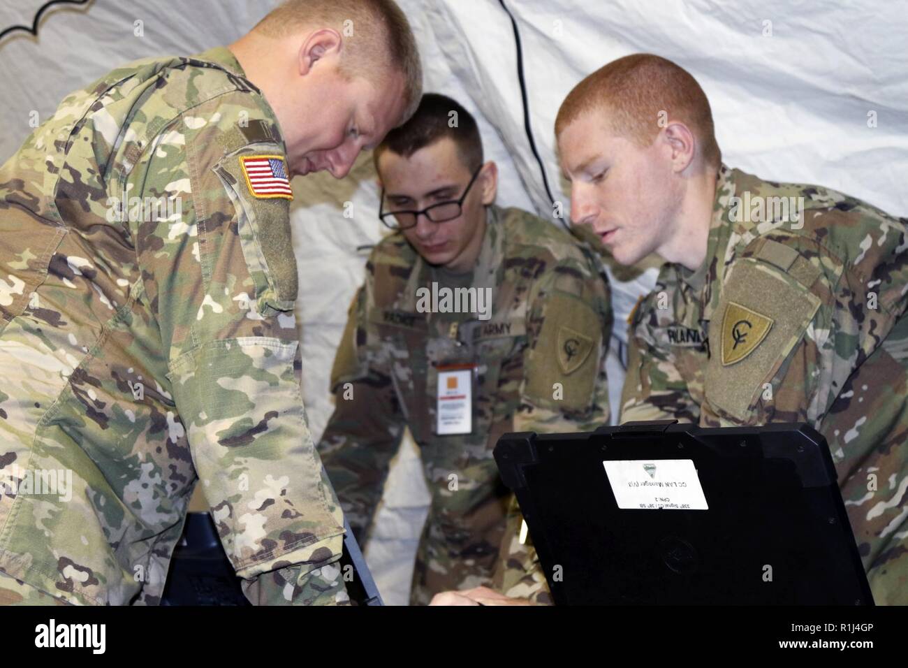 Spc. Jeremiah Wilk, Pfc. Andrew Radice, and Spc. Alex Roland test their ...