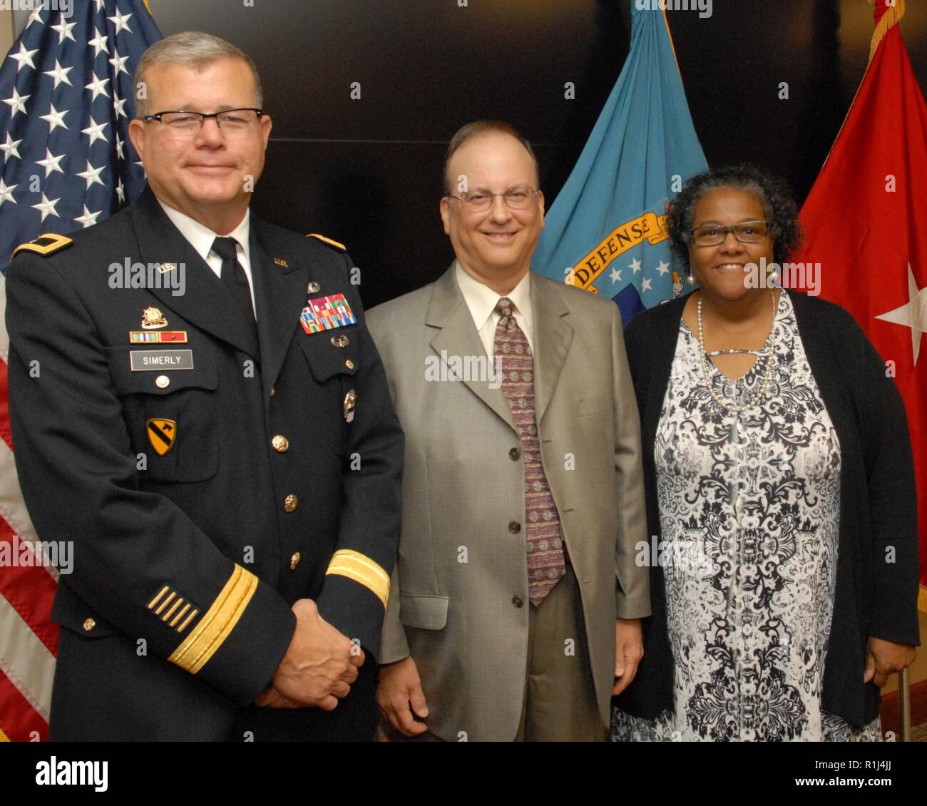 Anita Parker (right) and Philip DiBabbo (center) pose with DLA Troop ...