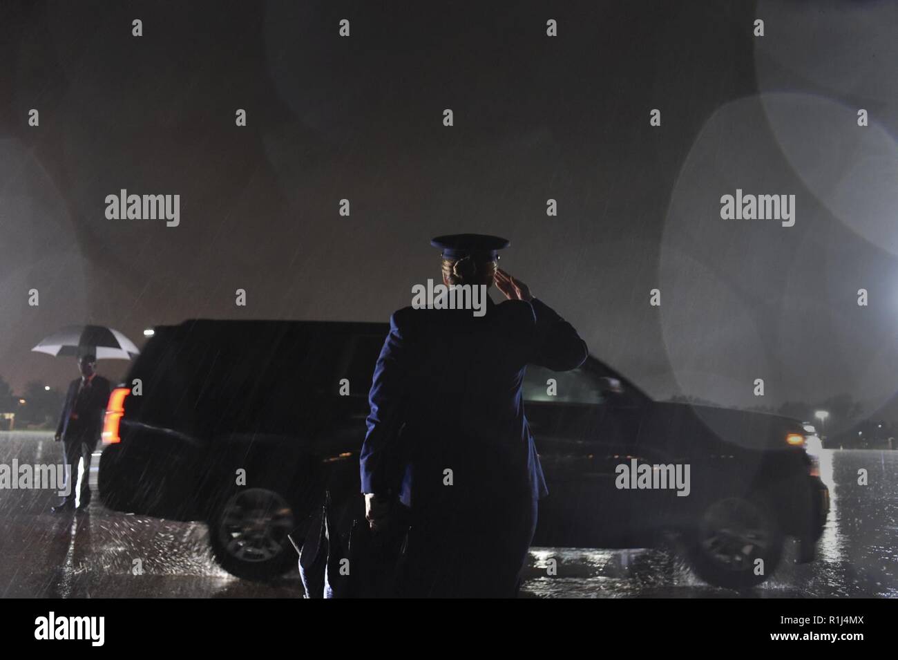 Col. Mary Teeter, 89th Maintenance Group commander, renders a salute as ...
