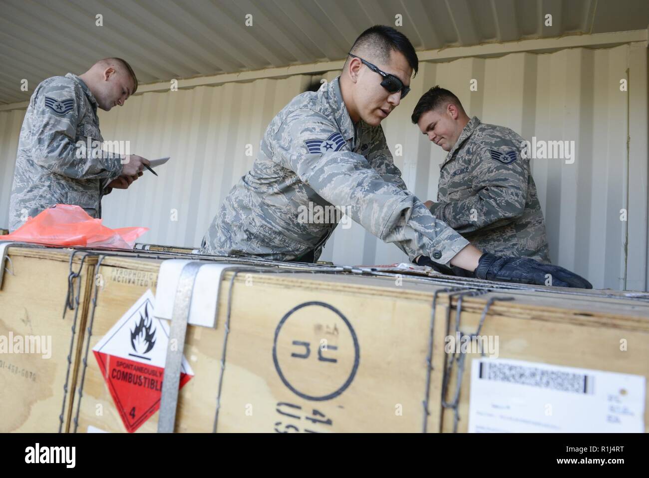 U.S. Airmen assigned to the 3rd Munitions Squadron, verify the ...