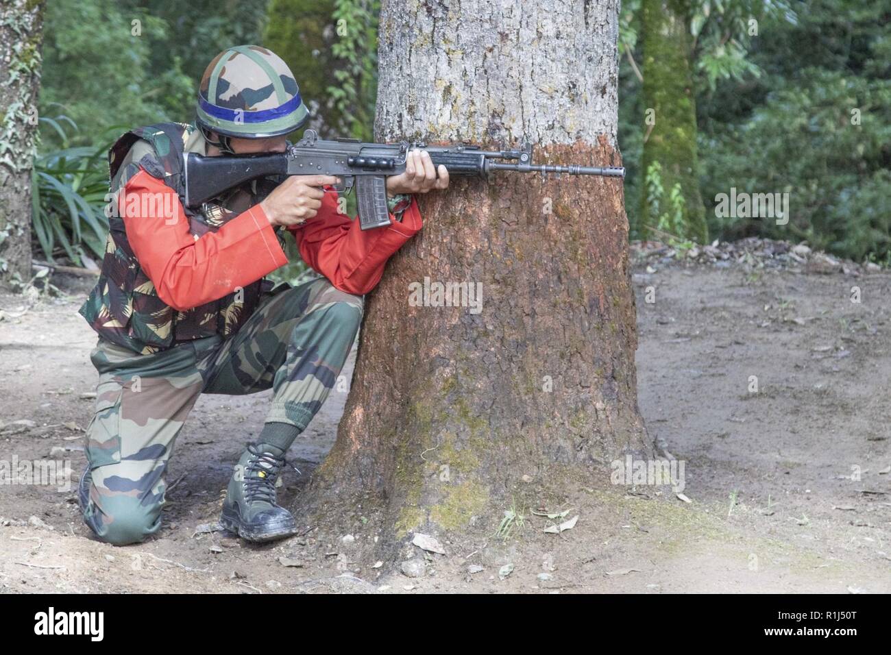 An Indian army soldier pulls security during a cordon and search ...