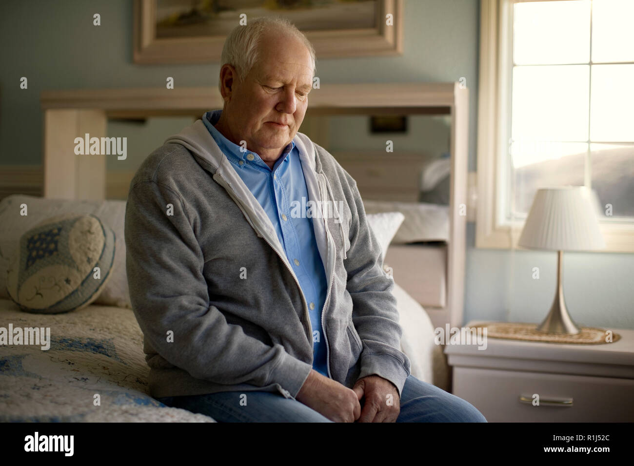 Old women sitting bed sad hi-res stock photography and images - Alamy