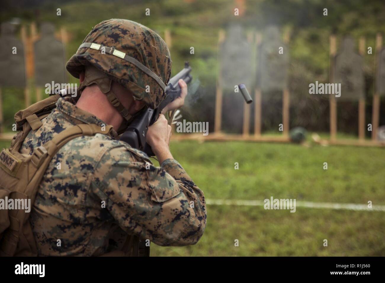 Lance Cpl. John O’Connor fires an M1014 shotgun during a shotgun ...