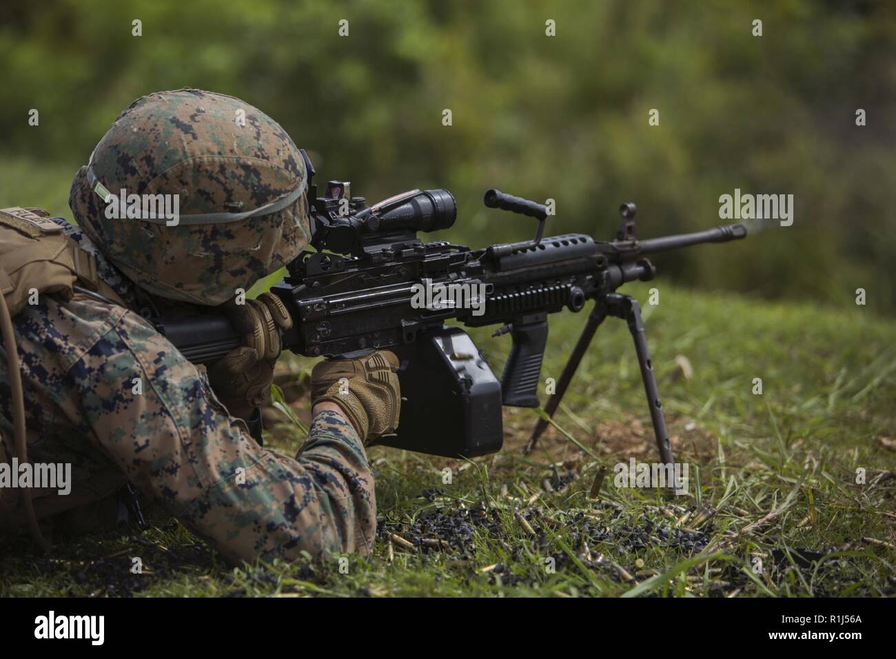 Lance Cpl. Caleb Fuller fires an M249 SAW light machine gun during a ...