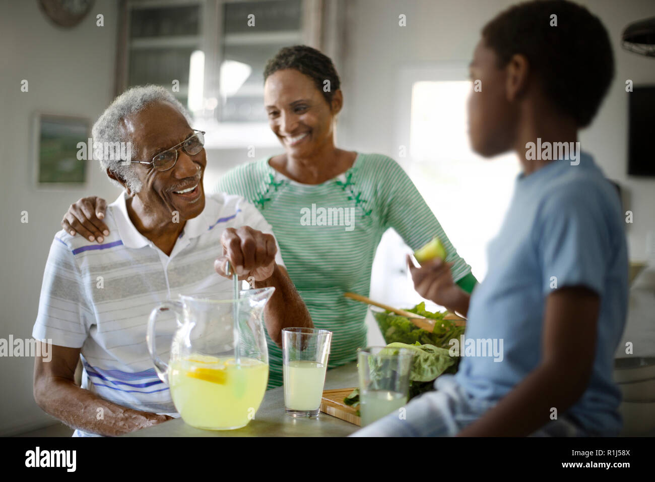 Family making lemonade Stock Photo - Alamy