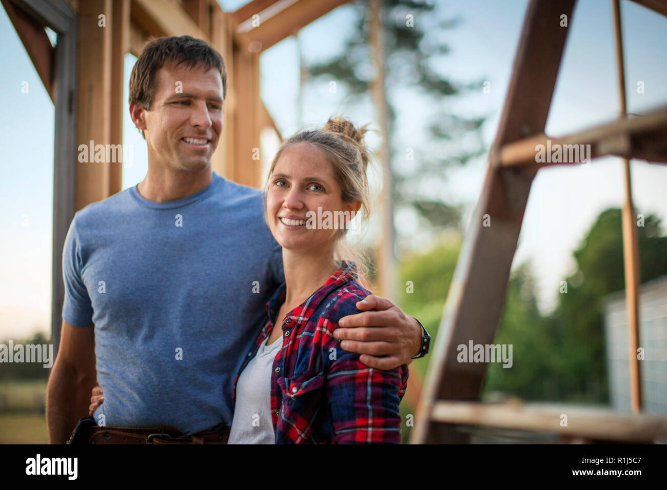 Happy young couple building their first home Stock Photo - Alamy