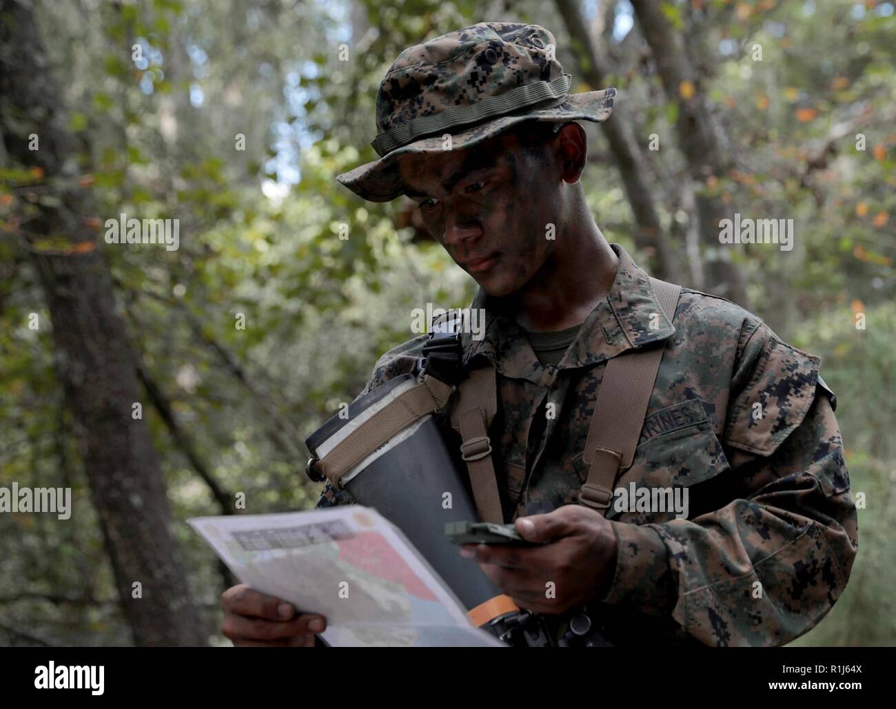 A recruit with Mike Company, 3rd Recruit Training Battalion, examine ...