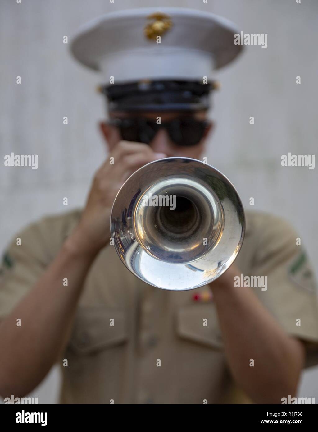 U.S. Marine Corps Lance Cpl. Austin Monnet plays the trumpet with the ...