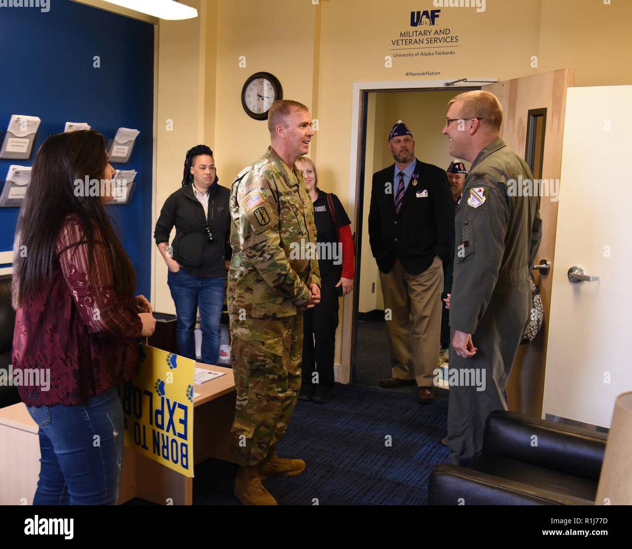 Student assistant Cierra Blalock listens in as Col. Sean Fisher ...