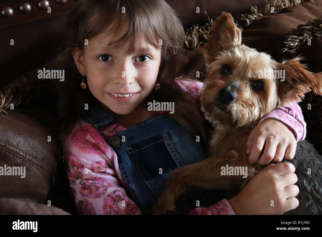 Young girl cuddling with her best friend Stock Photo - Alamy