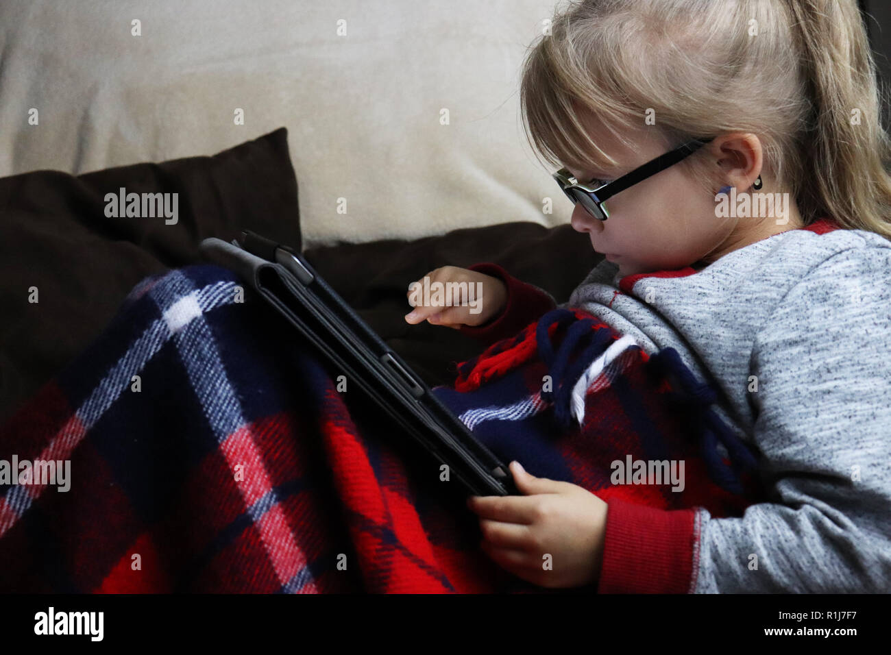 Toddler playing on a tablet Stock Photo - Alamy