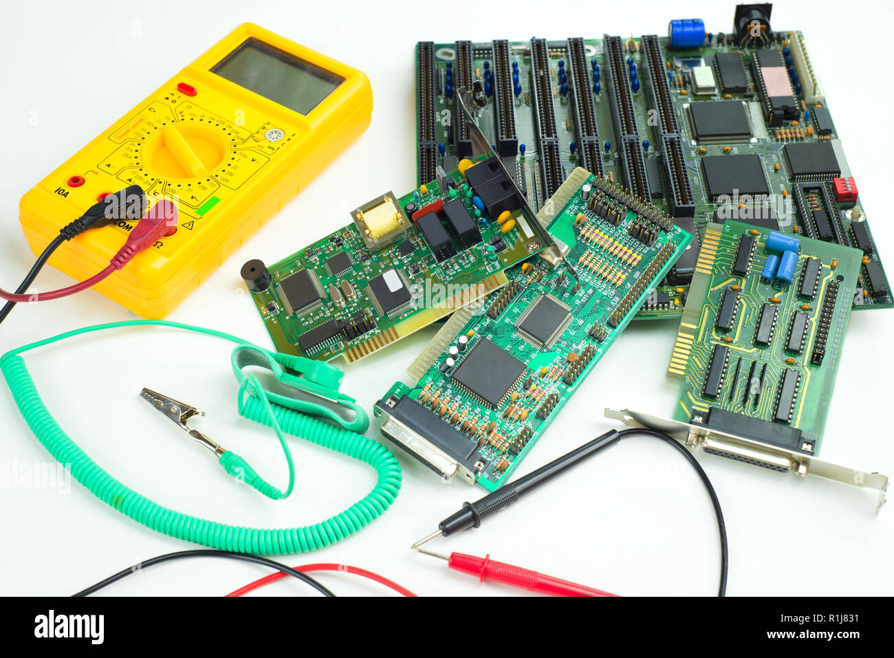 Digital clamp meter, antistatic wrist strap and computer circuit boards ...