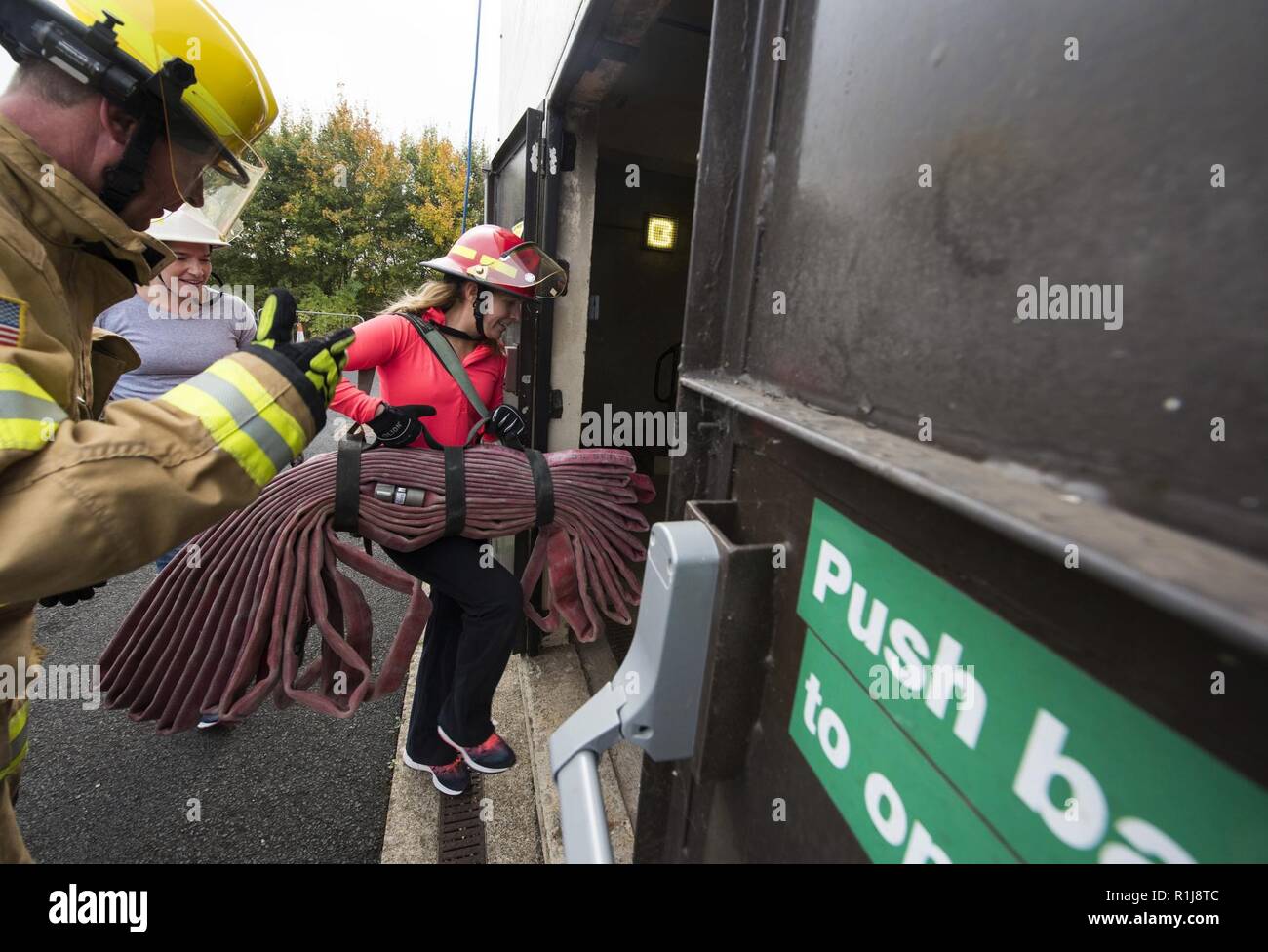 Contestants compete in a Firefighters Challenge at RAF Croughton ...