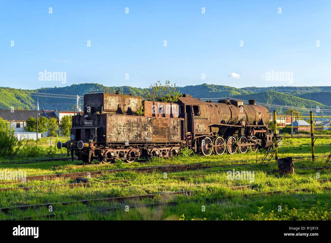 Vintage rusty train locomotive in the countryside Stock Photo - Alamy