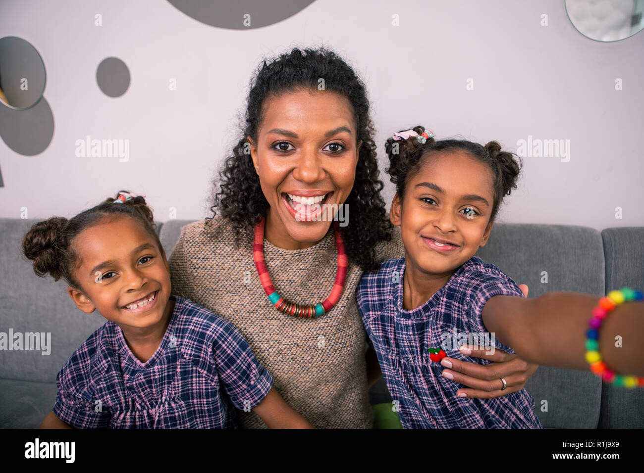 Appealing woman feeling amazing spending weekend with children Stock ...