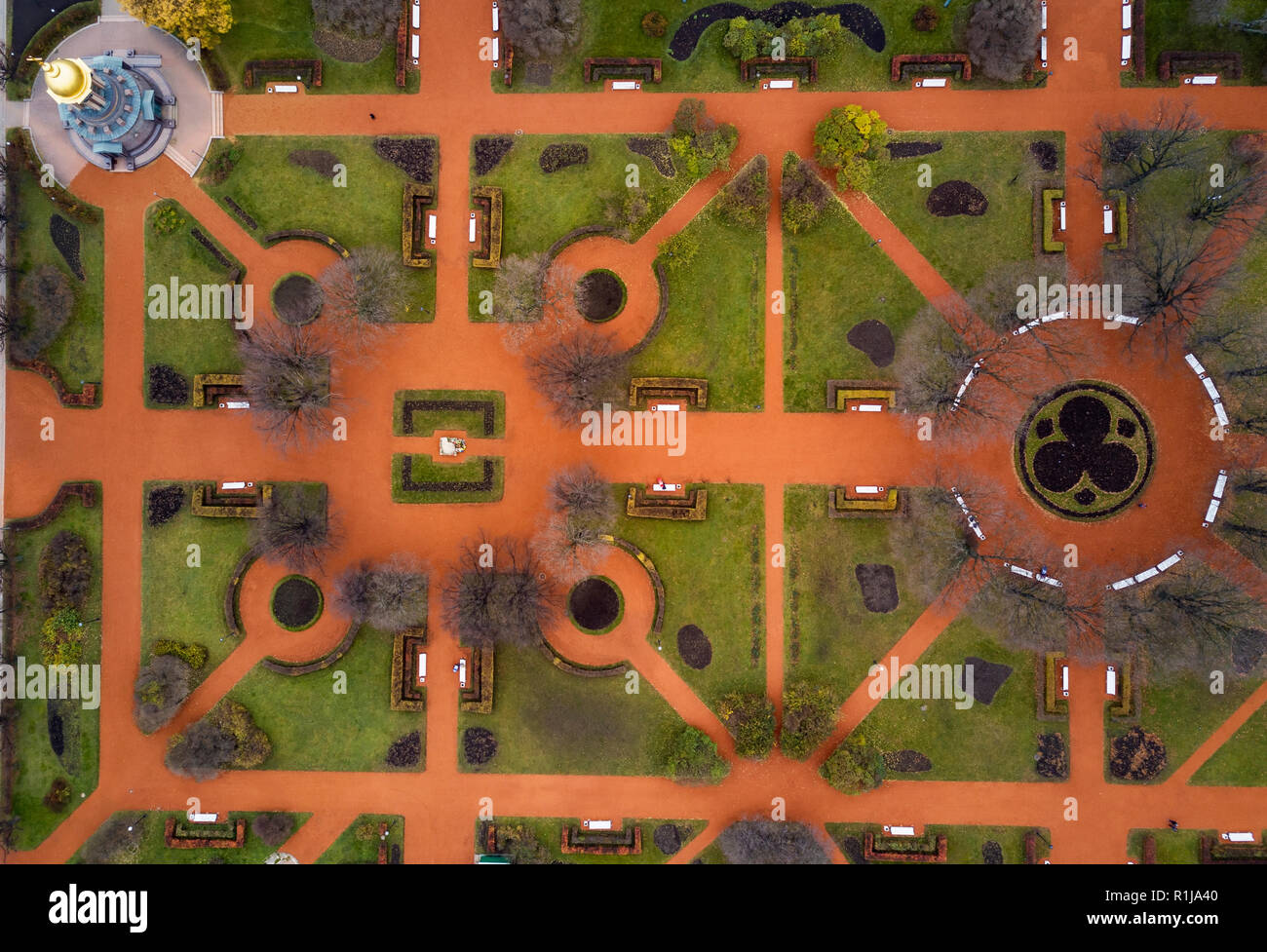 Aerial drone top down view of autumn park with paths and trees ...