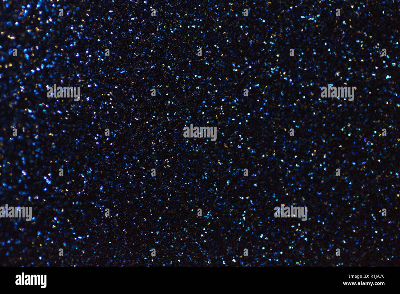 Dark navy blue sparkling background from small sequins, closeup ...