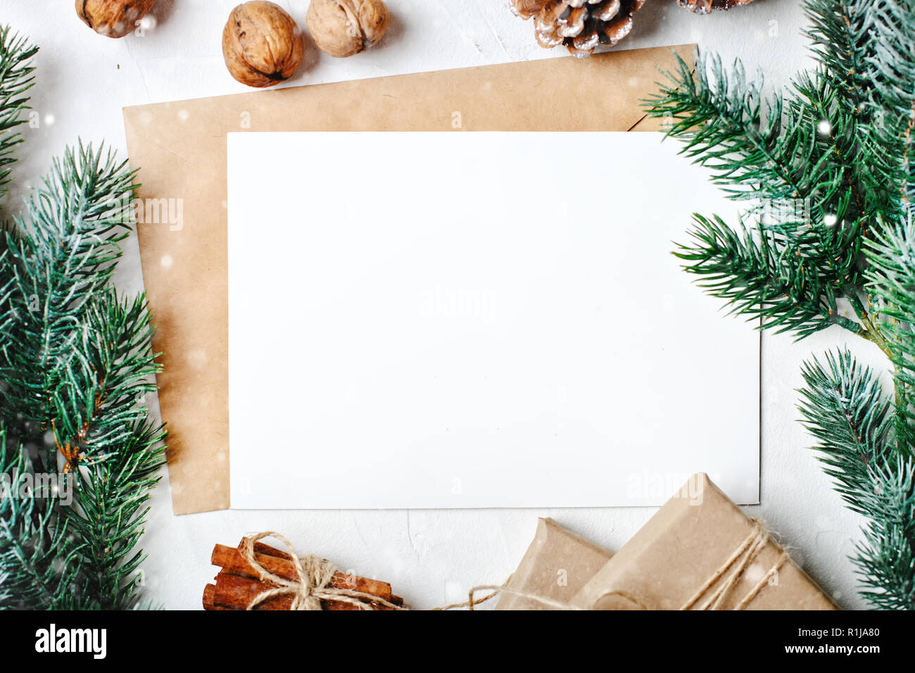 Merry Christmas and happy New year. Mockup with postcard and branches ...