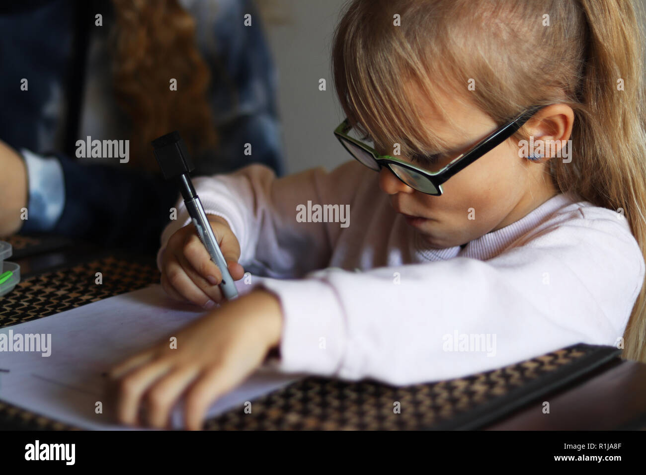 Child portrait write homework hi-res stock photography and images - Alamy