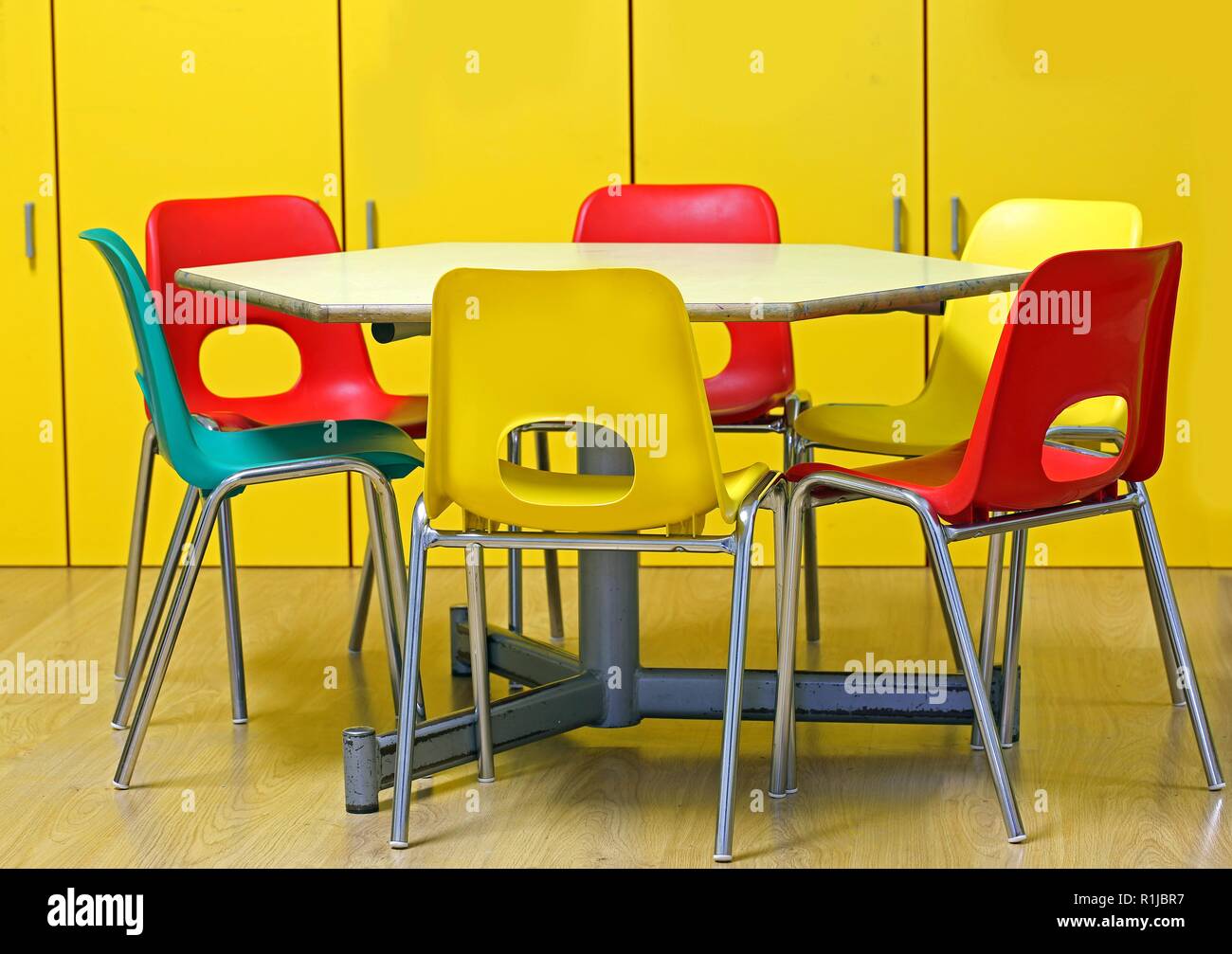 small chairs and a table in the classroom of a school without children ...