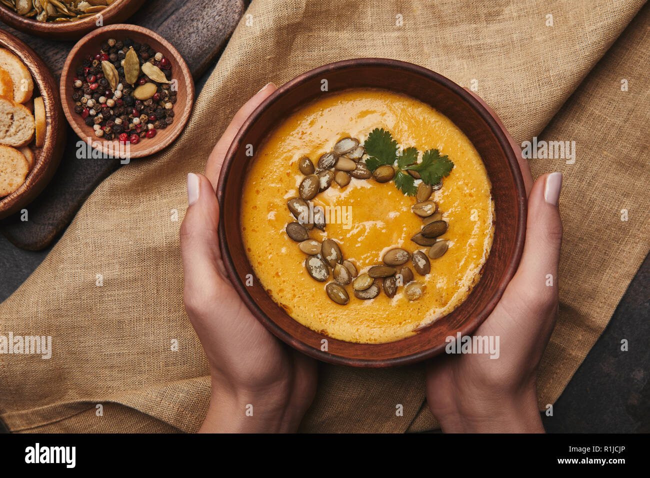 Hands holding bowl vegetable soup hi-res stock photography and images ...