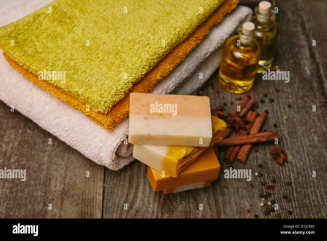 close-up shot of soap pieces with stacked towels, spices and massage ...