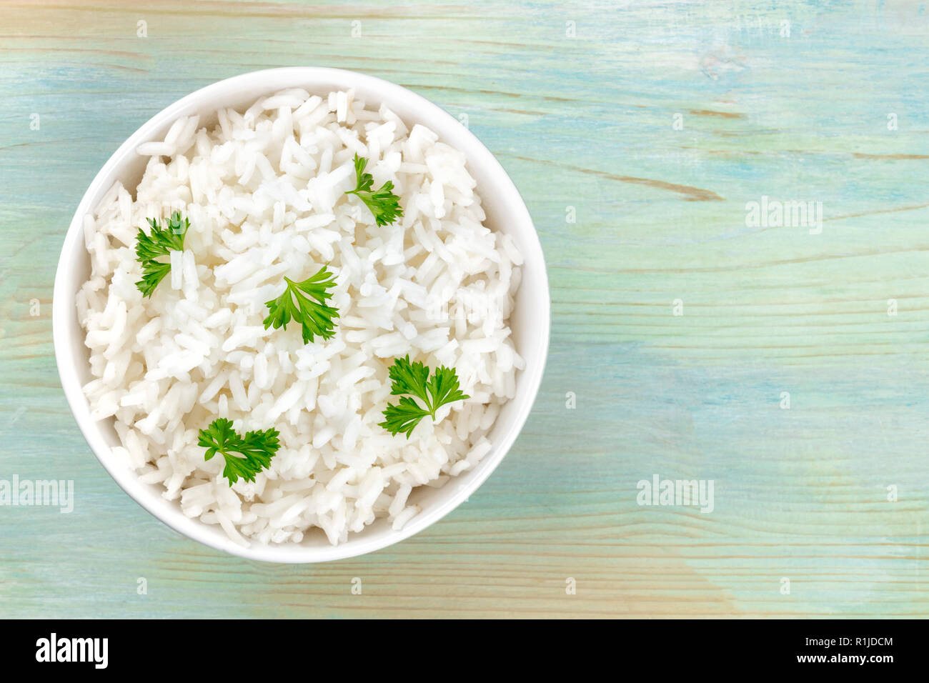 A photo of a bowl of cooked white long rice, shot from the top on a ...