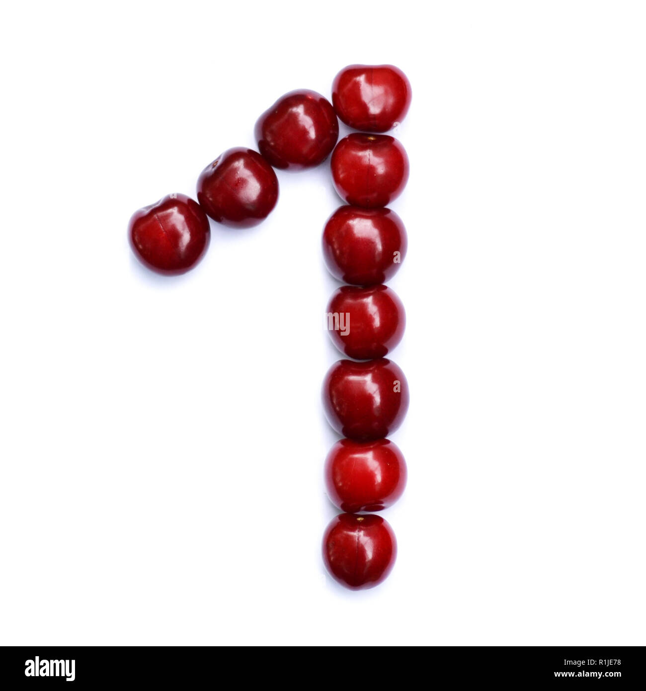 Number one. A figure composed of cherries isolated on a white ...