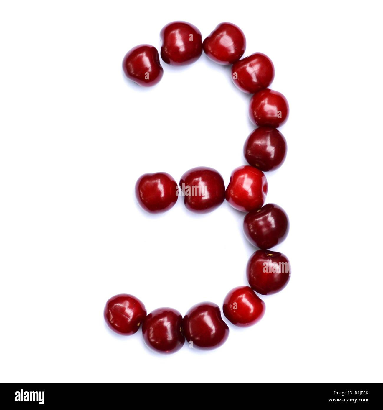 Number three. A figure composed of cherries isolated on a white ...