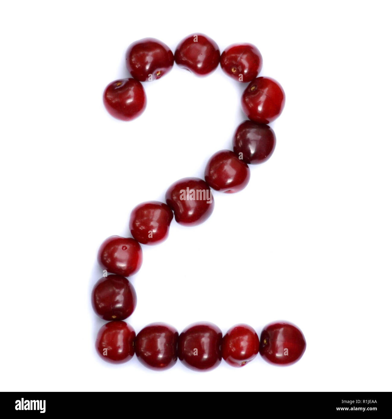 Number two. A figure composed of cherries isolated on a white ...