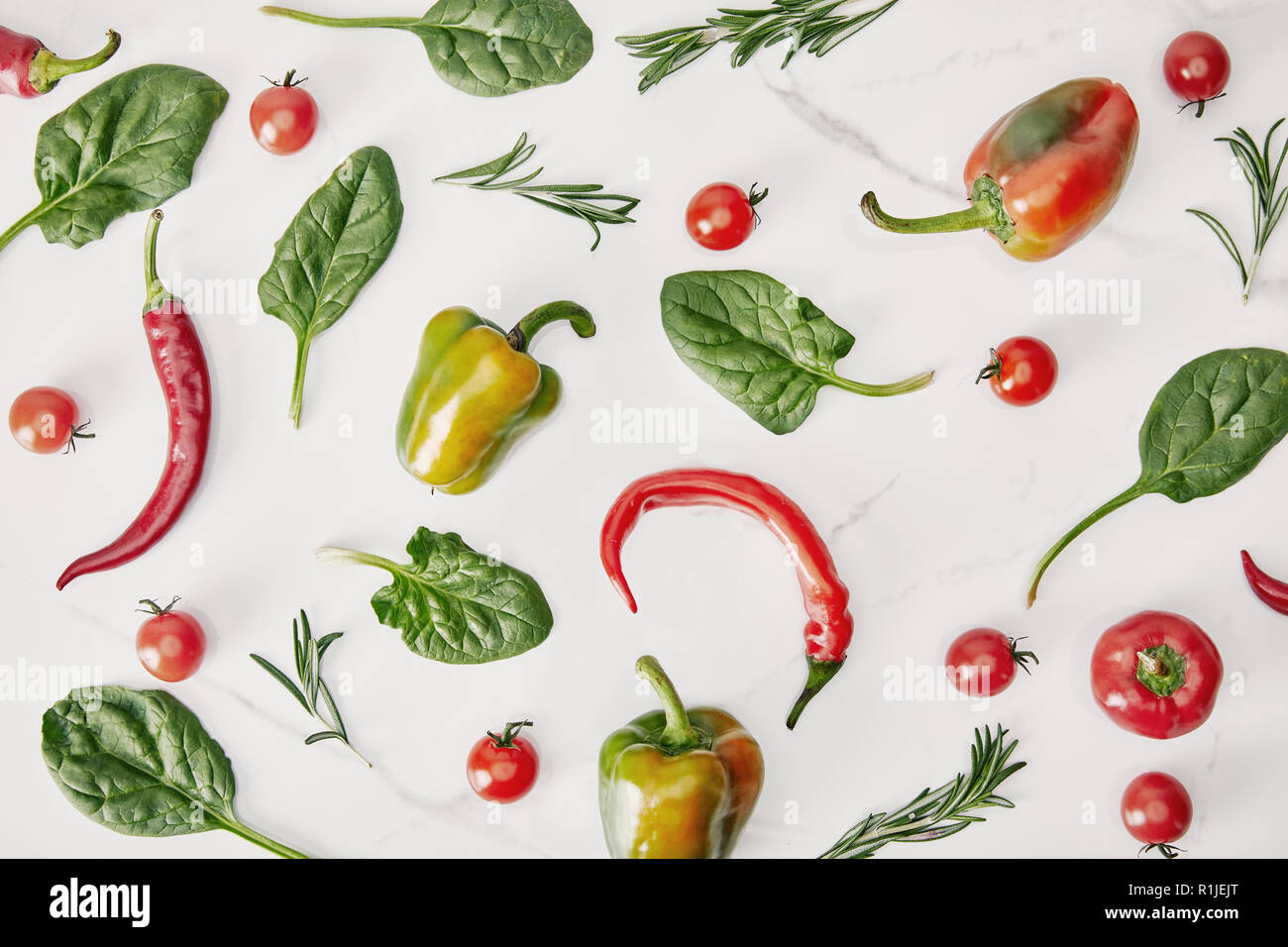 colorful flat lay with various herbs and vegetables on white background ...