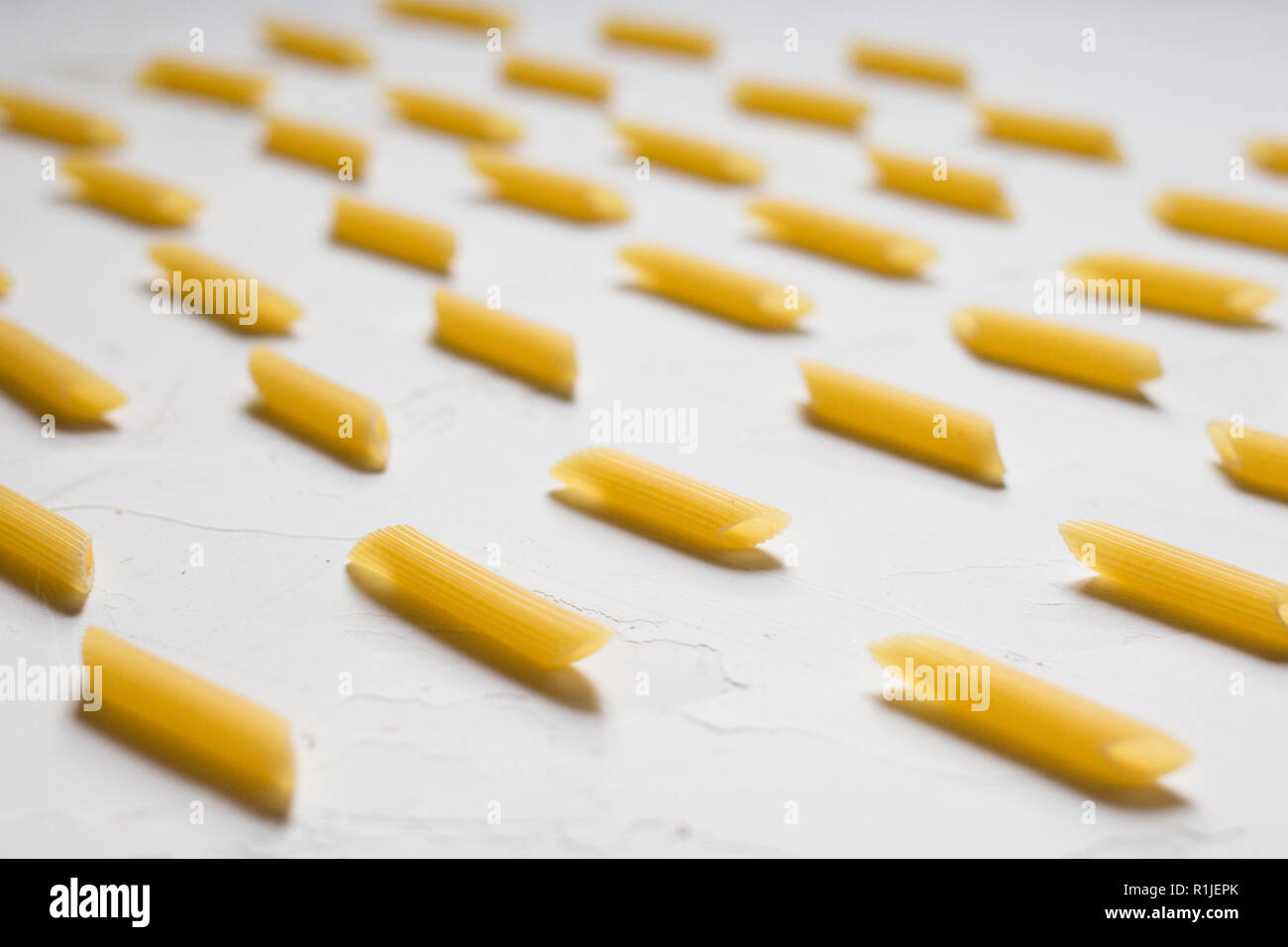 Italian Penne Rigate Macaroni Pasta raw food background or texture ...