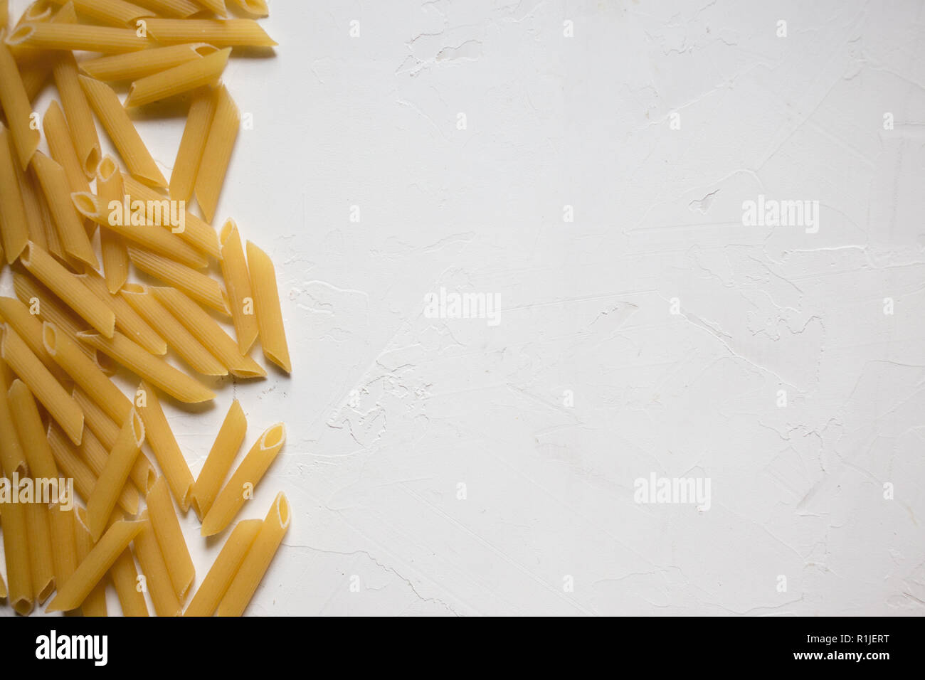 Italian Penne Rigate Macaroni Pasta raw food background Stock Photo - Alamy
