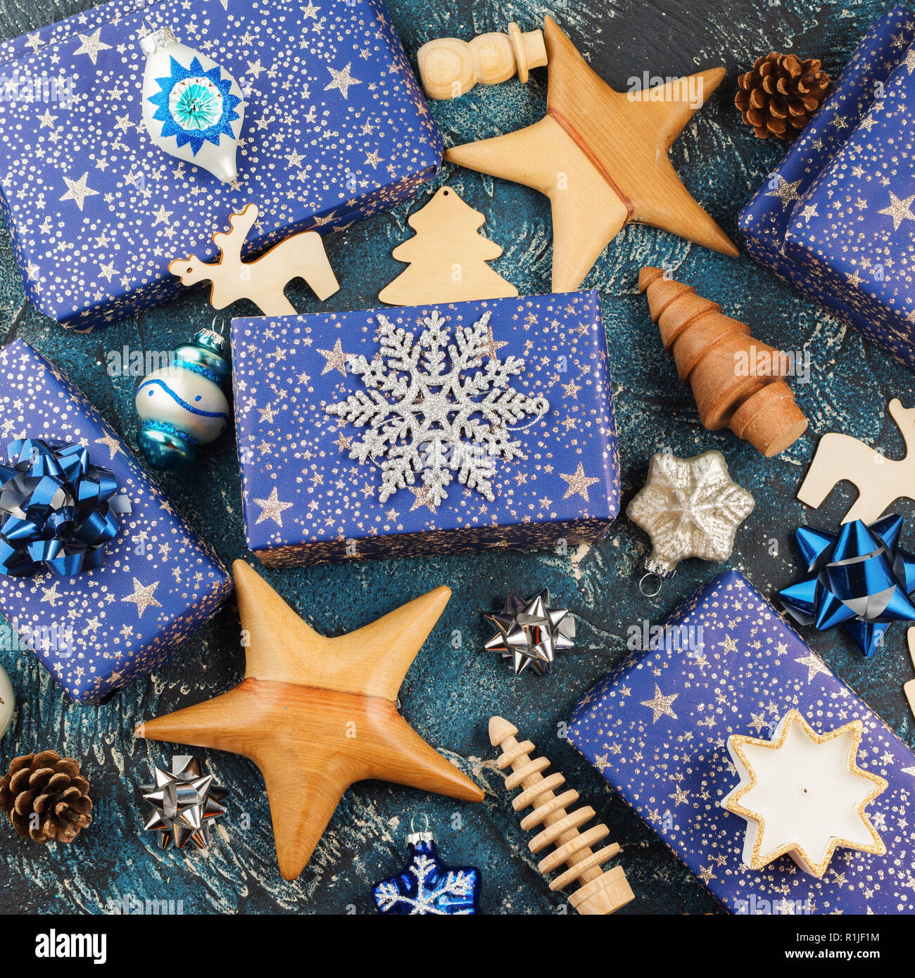 Creative chritmas arrangement. Presents in dark blue wrapping paper ...