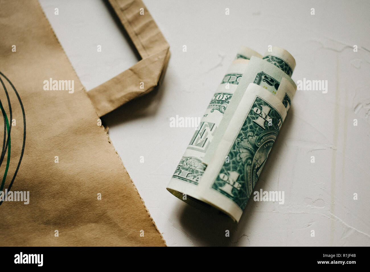 Cash dollars money, with a Kraft package on white background Stock ...