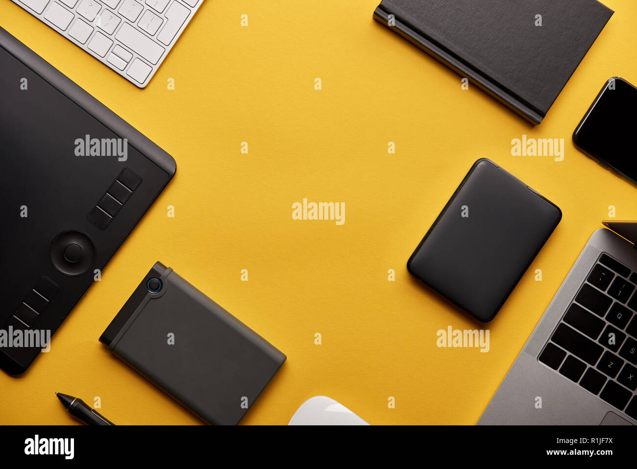 top view of different wireless gadgets on yellow surface Stock Photo ...
