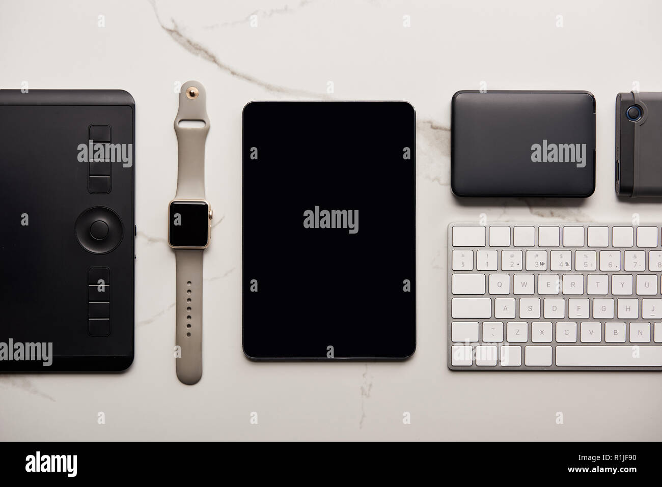 flat lay with various wireless devices on white marble surface Stock Photo - Alamy