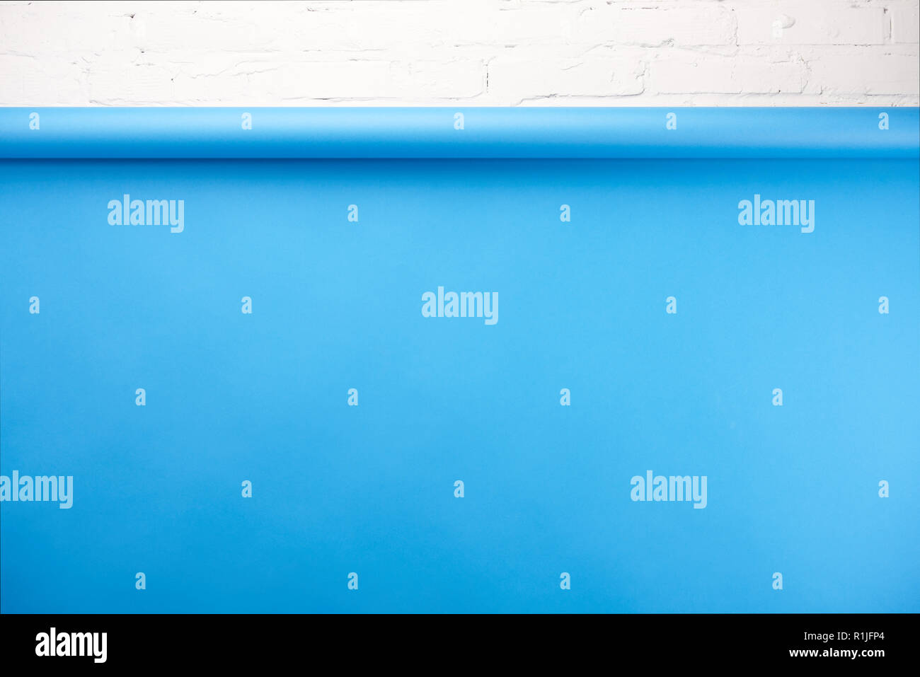 bright blue background and white brick wall Stock Photo - Alamy
