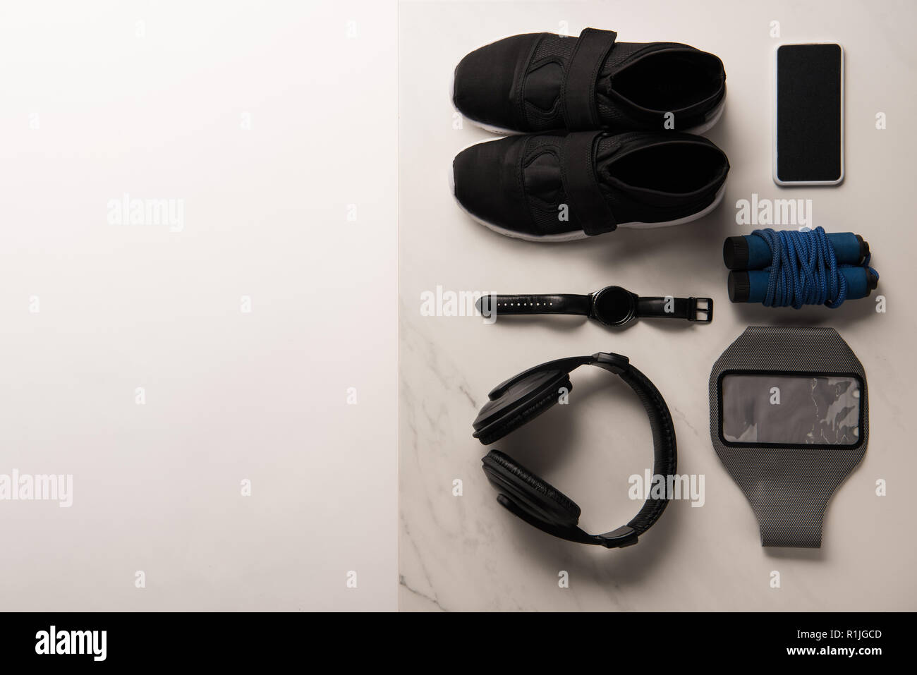 view from above of composition with gym equipment on white and marble ...