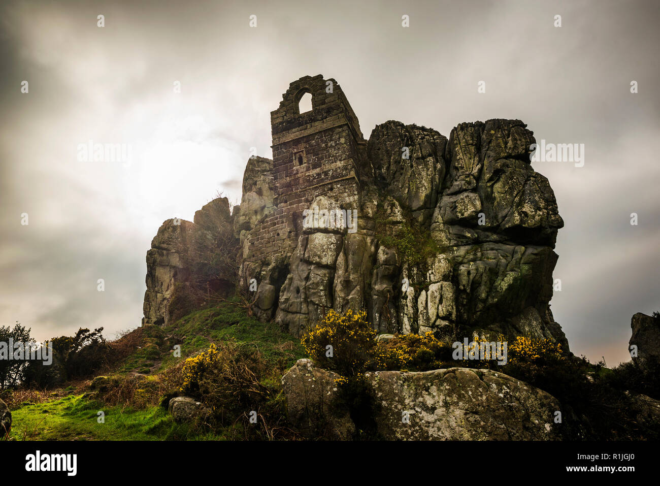 Formidable looking building built into the rock face with a very gloomy ...