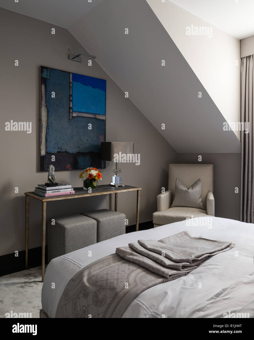 Modern table over table in bedroom Stock Photo - Alamy