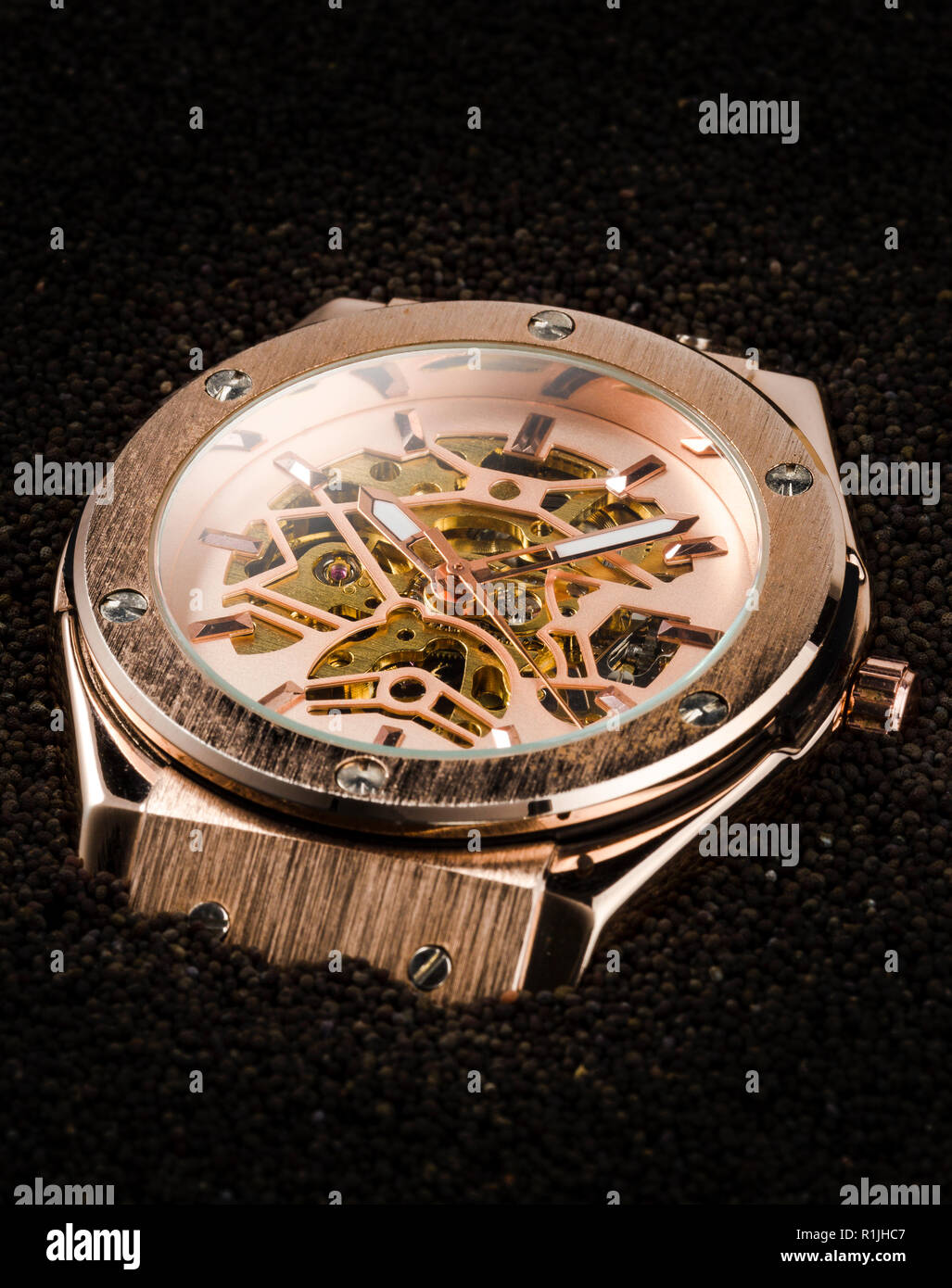 Golden watch on black background Stock Photo - Alamy