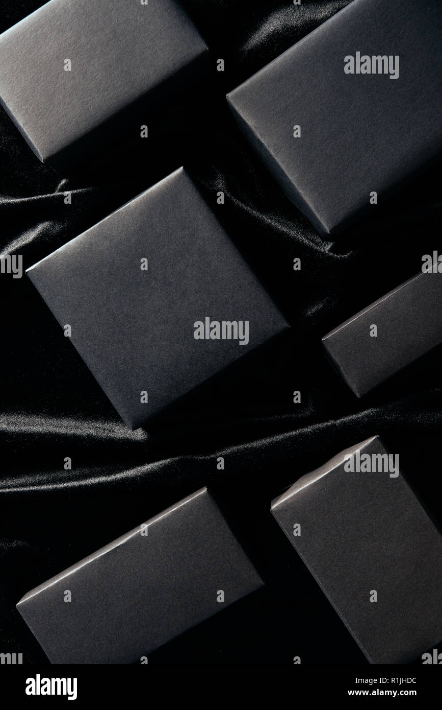 flat lay with blank boxes on black backdrop, black friday concept Stock ...
